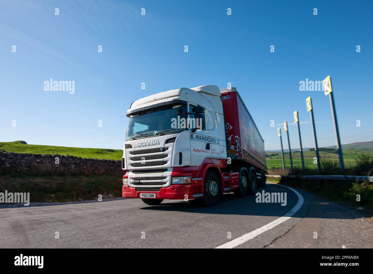 Scania truck on a tight corner on the the A623, coming up the hill from ...