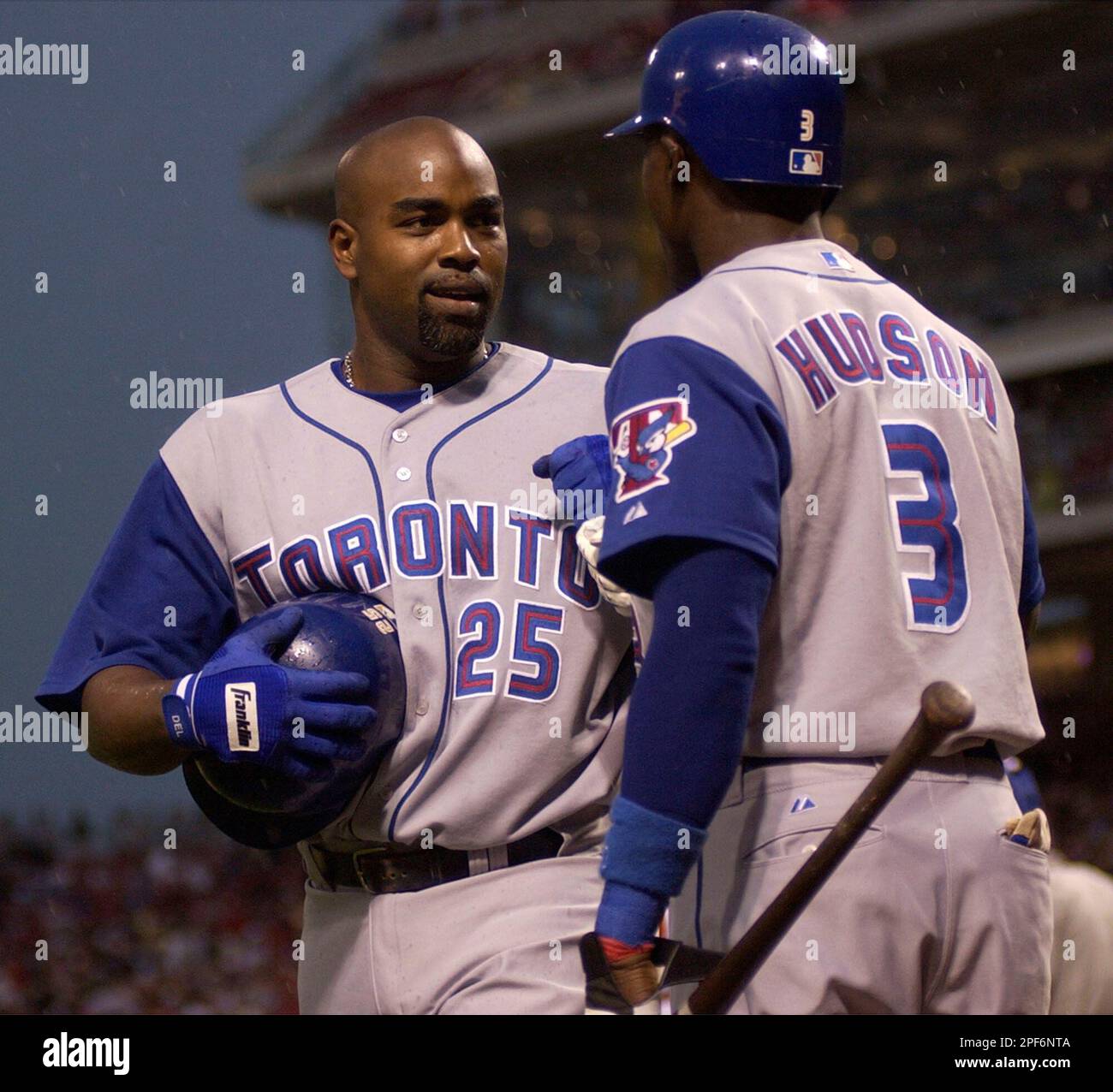 Toronto Blue Jays' Carlos Delgado (25) is congratulated by Orlando ...