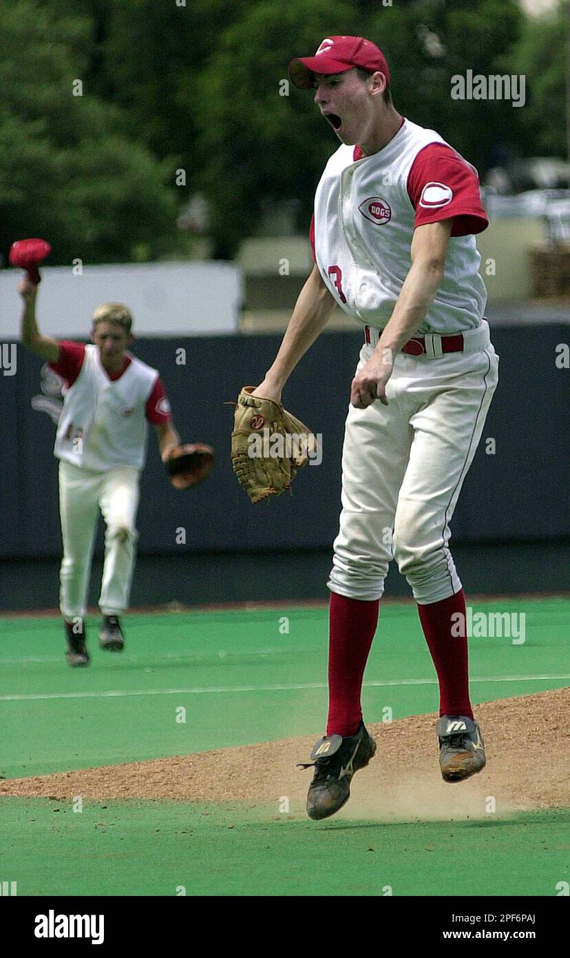Colmesneil's pitcher Chad Coggins, right, celebrates after his team ...