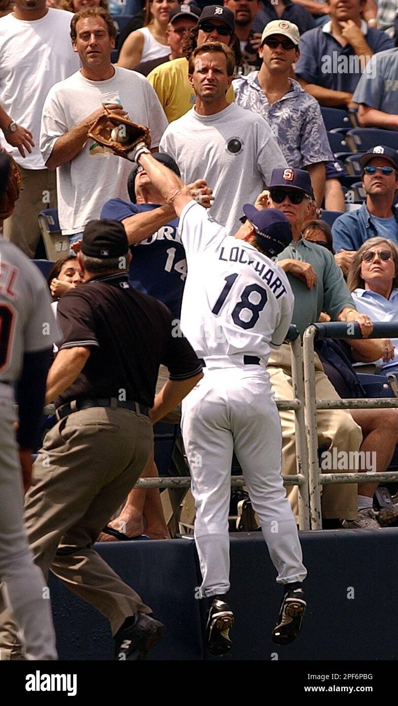 San Diego Padres third baseman Keith Lockhart goes into the stands to ...