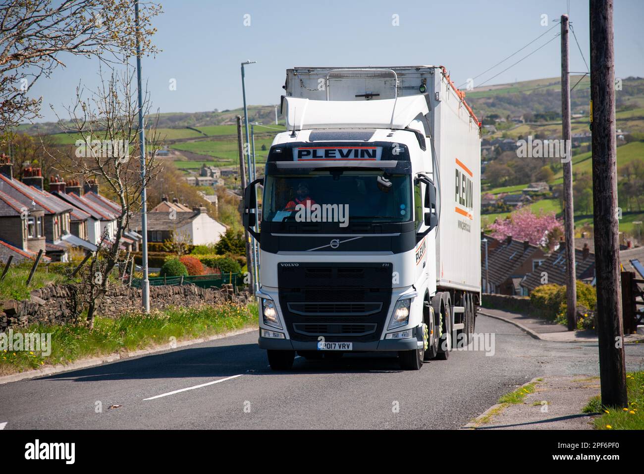 Plevin Recycling Volvo truck climbing the hill out of the village of ...