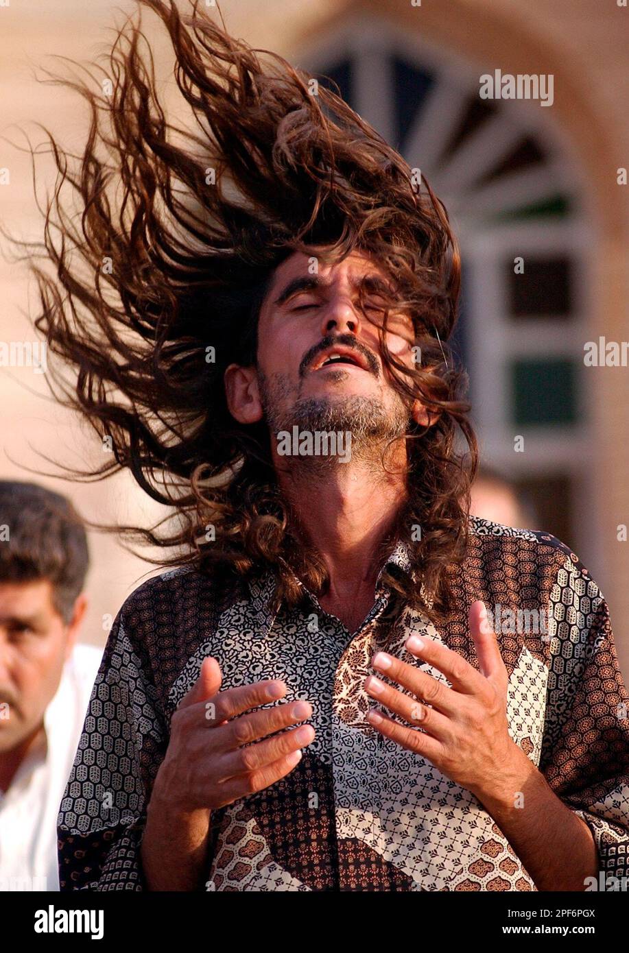 Iraqi men ululate at the sound of drums during a Sufi Muslim ceremony ...