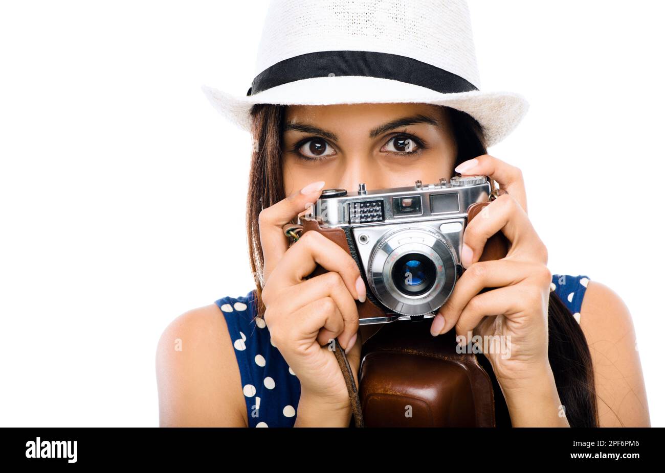 Bringing her vision to life. a young woman taking photos against a ...