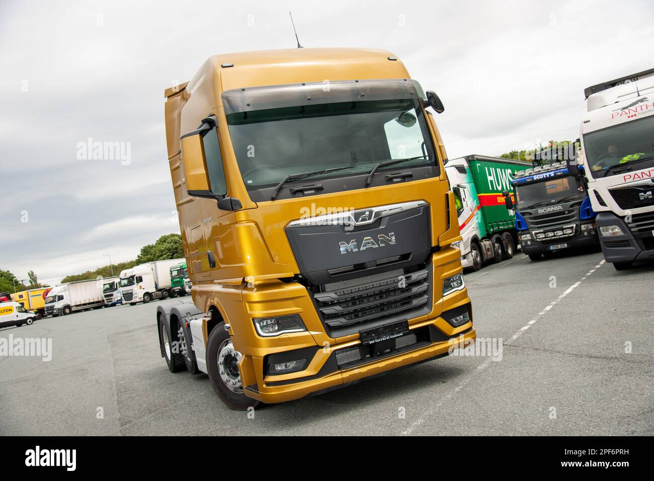 Brand new MAN TGX tractor unit parked in a motorway service station car ...