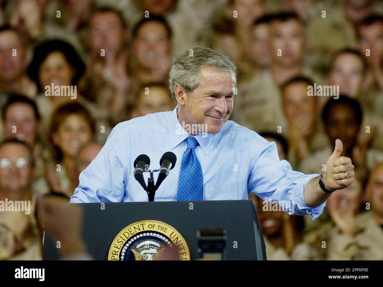 U.S. President George W. Bush, gives a "thumbs up" after being ...