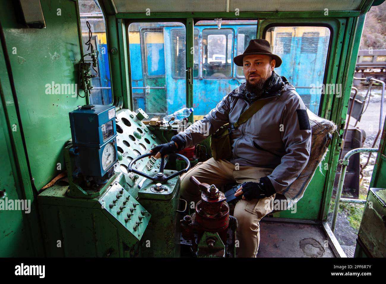 Engine train driver inside of locomotive control room Stock Photo - Alamy