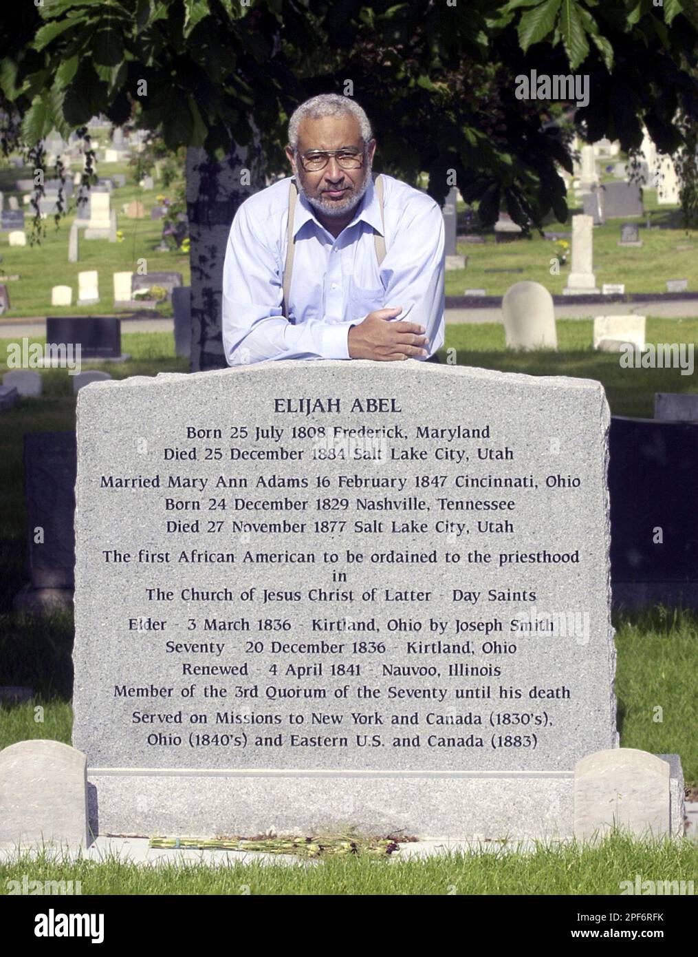 Darius Gray poses behind the tombstone of Elijah Abel Friday, May 30 ...