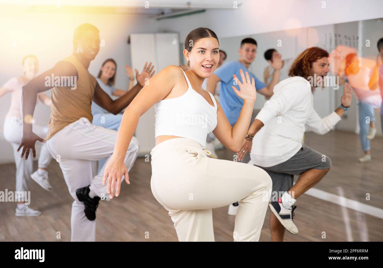 Group dancers performing dynamic movements hi-res stock photography and ...