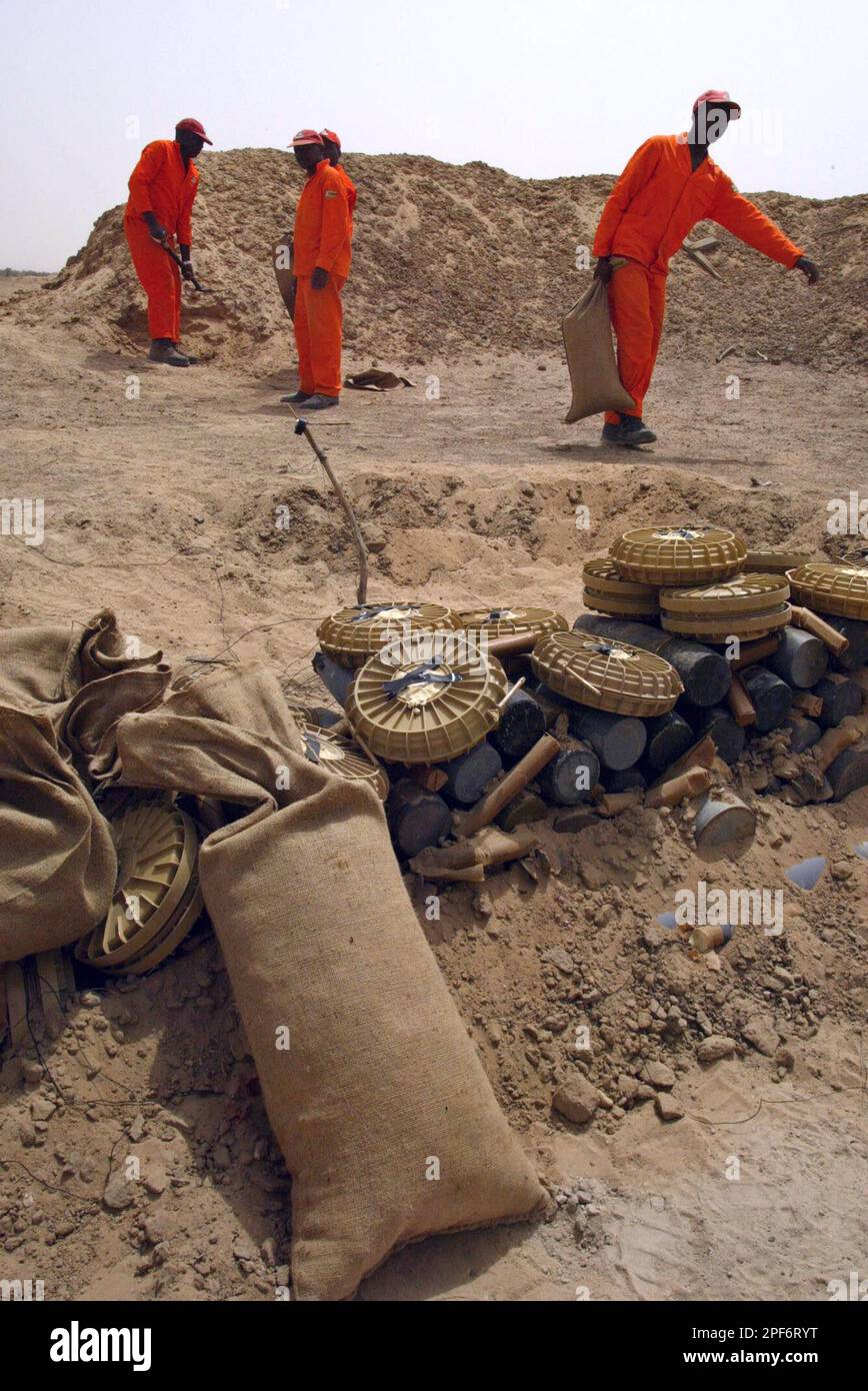 A Zimbawe mine clearing team prepares a demolition site for unexploded ...