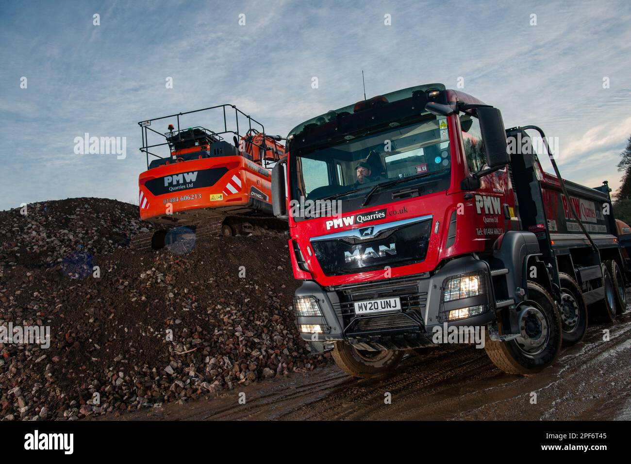 MAN TGS eight-wheel tipper being loaded by a Dousan dx140lc in a quarry ...