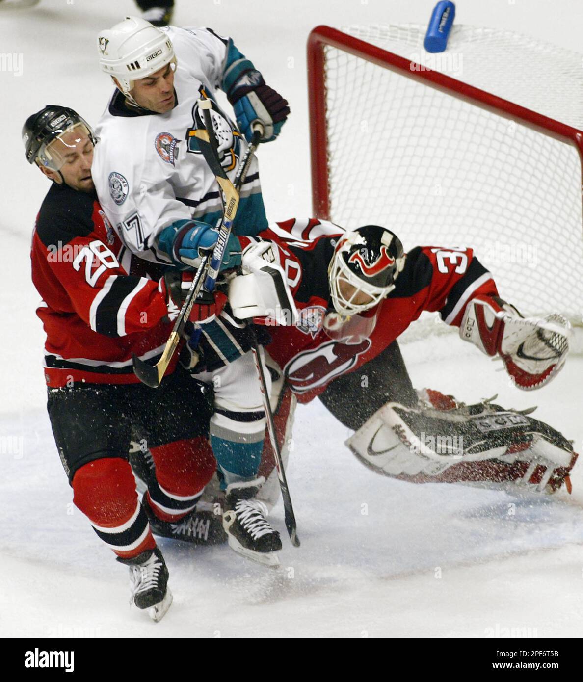 New Jersey Devils defenseman Brian Rafalski tries to take out Anaheim ...
