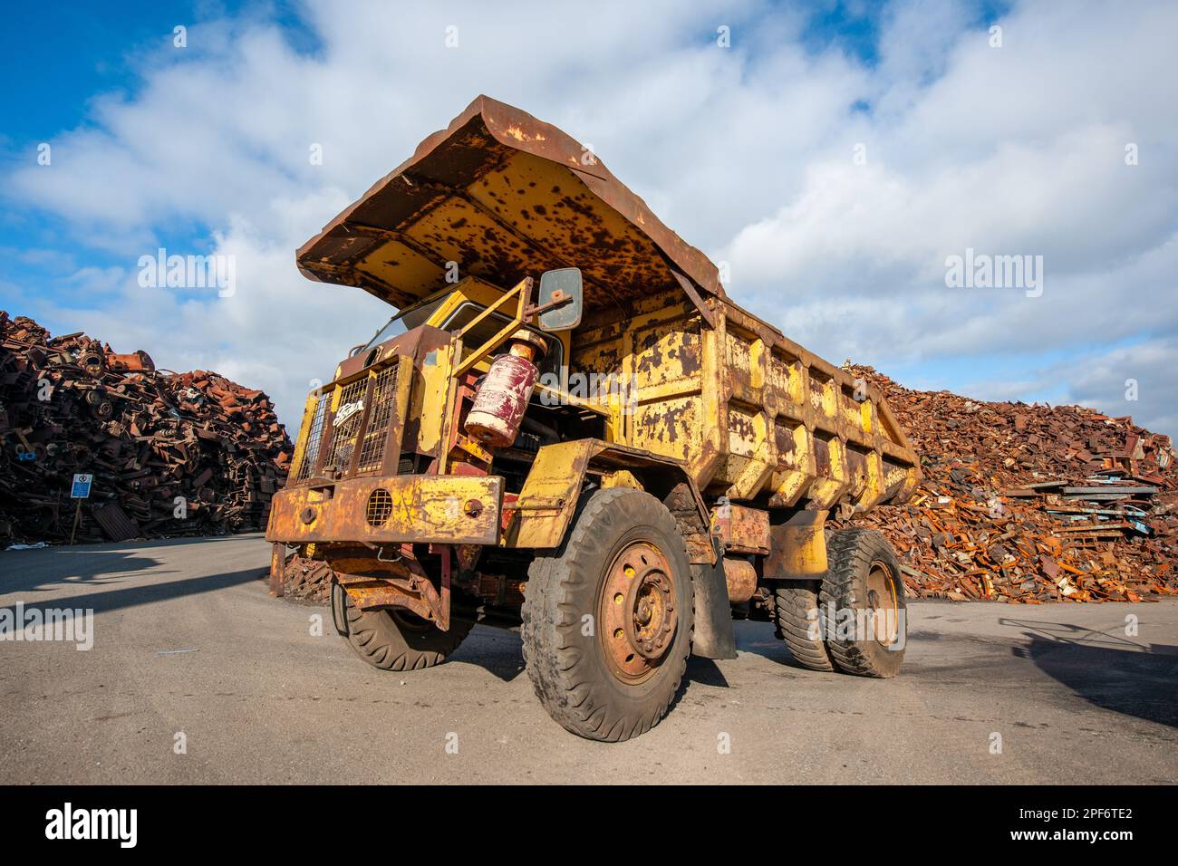 Foden FL Dump Truck parked next to a large mound of scrap steel and ...