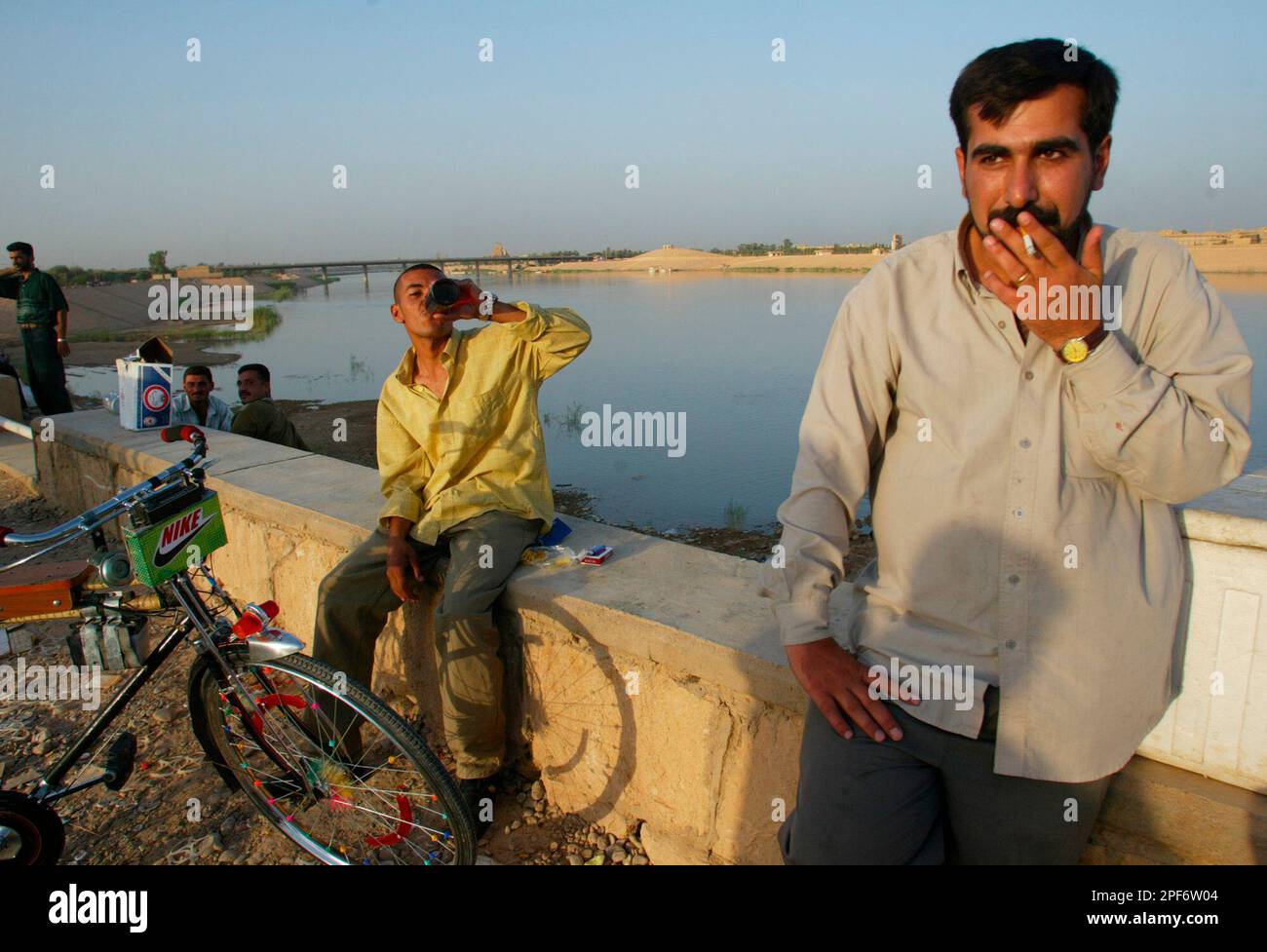 Local residents enjoy alcoholic drinks on the bank of river Tigris in ...