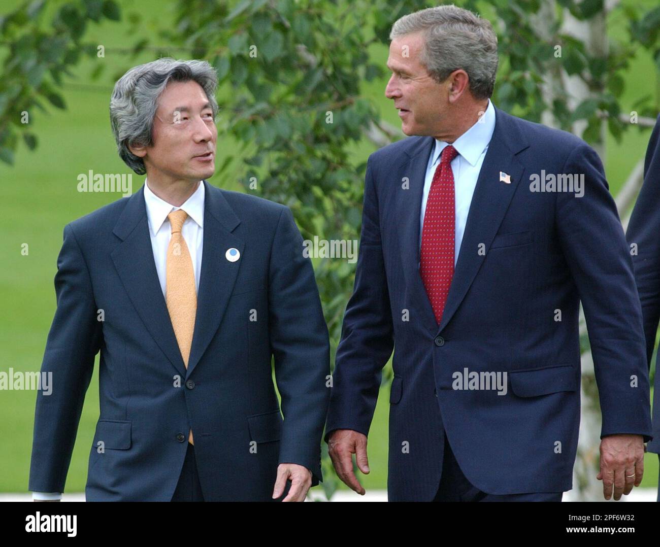 Japan's Prime Minister Junichiro Koizumi, left, shares a word with U.S ...