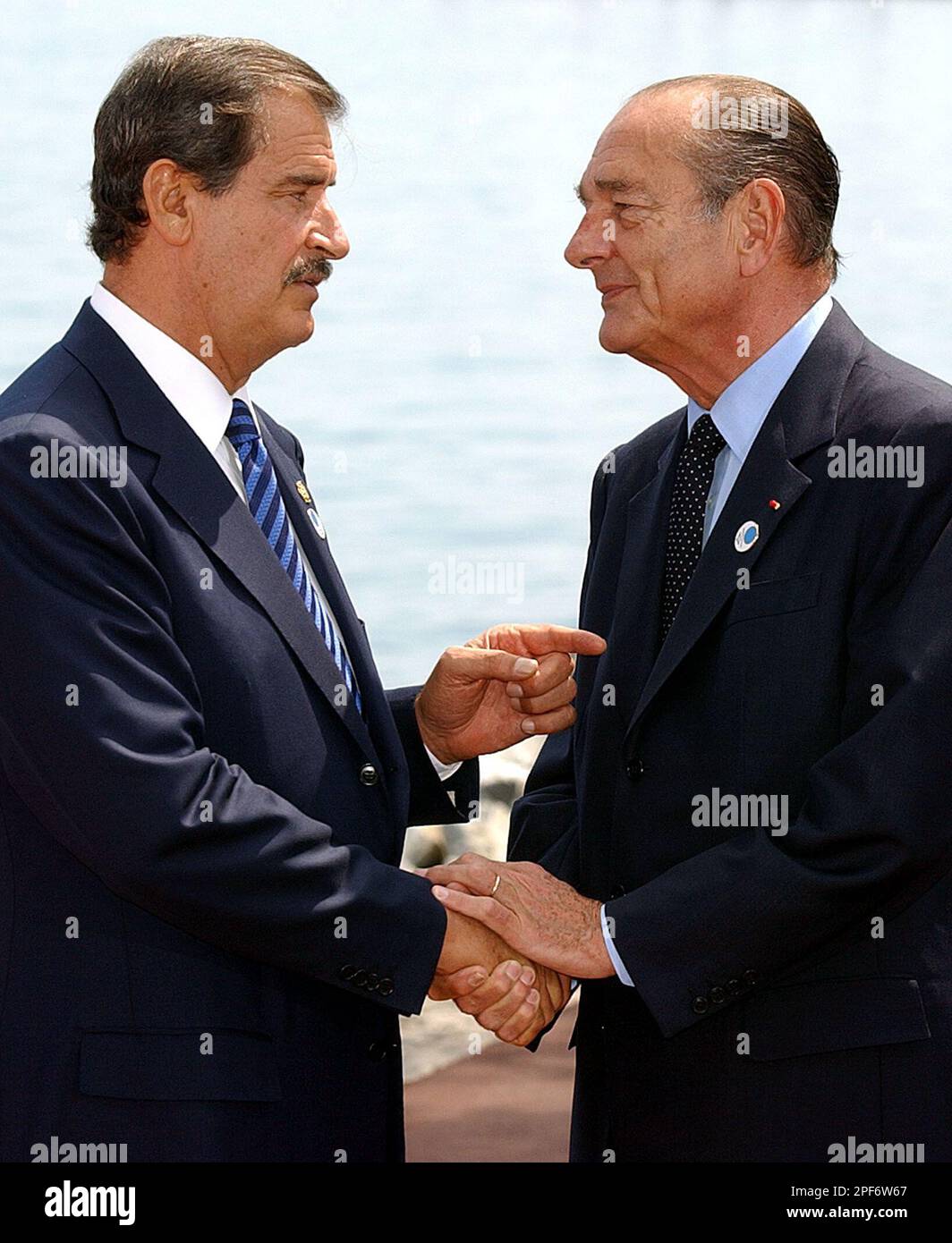 French President Jacques Chirac, right, shakes hands with the President ...