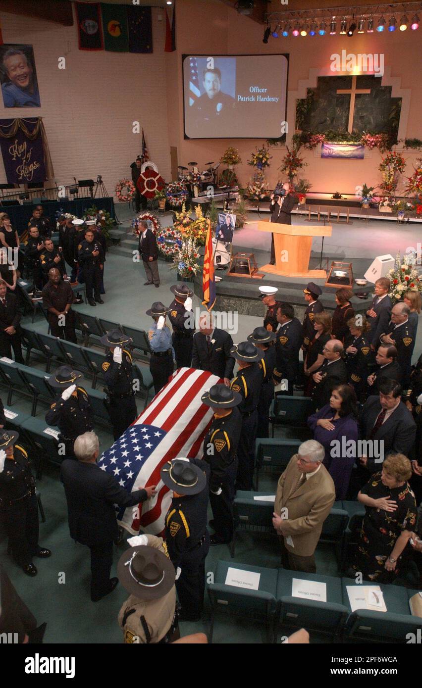 The body of Tucson, Ariz. Police officer Patrick Hardesty, is carried ...