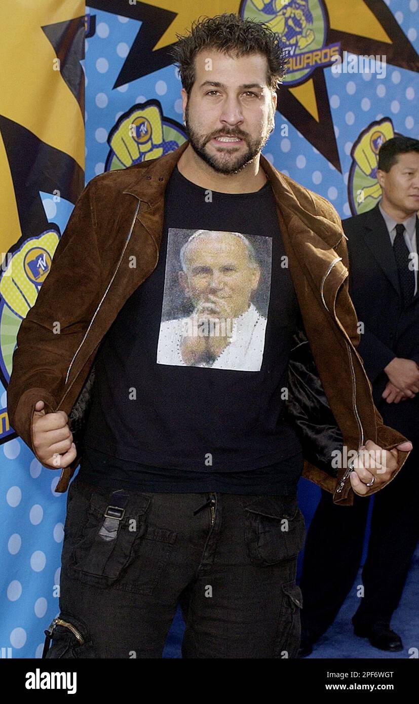 Singer Joey Falone from the band "NSync" shows off his tee-shirt of ...