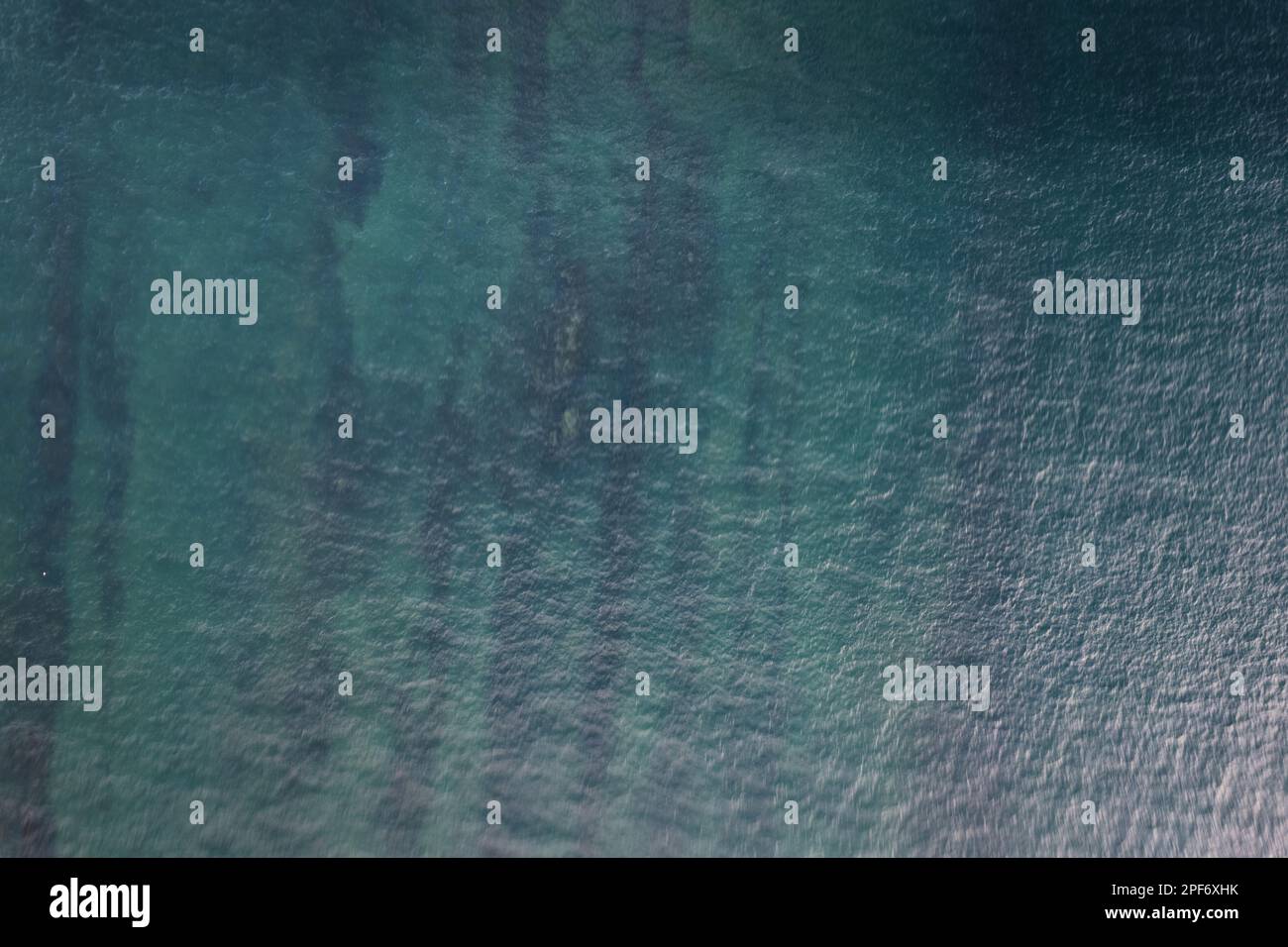 Colorful turquoise sea rippled water texture above top view Stock Photo ...