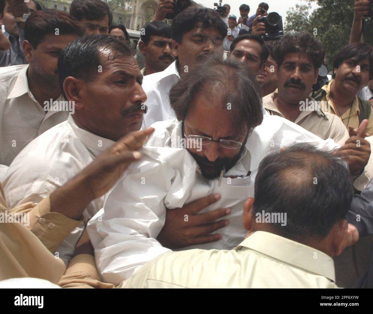 Pakistani legislator Samiullah Khan, (in center, glasses) from ...