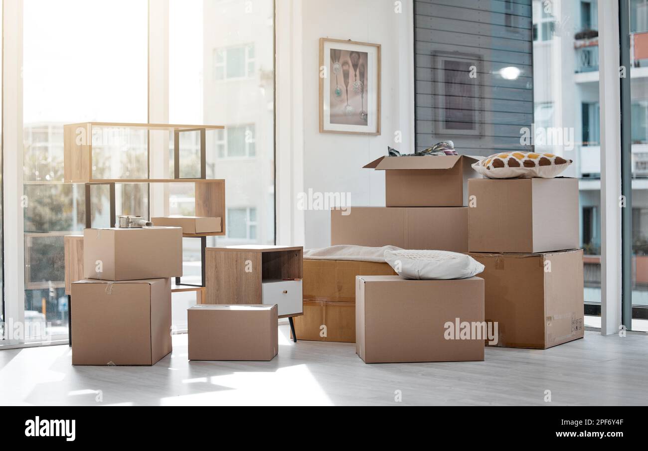 An apartment waiting to become home. boxes in a new and empty home ...