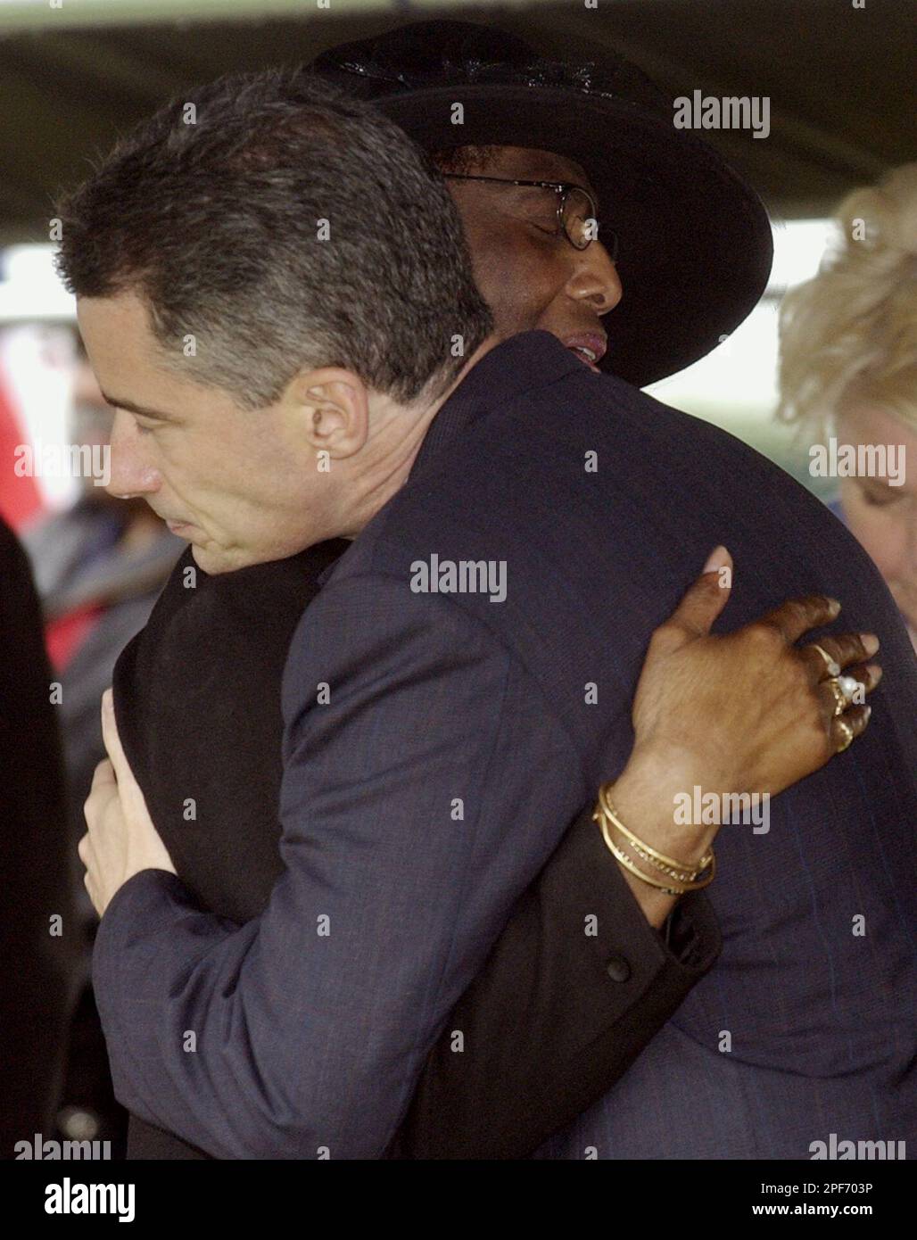 New Jersey Gov. James McGreevey, right, hugs Eva Shannon, mother of U.S ...