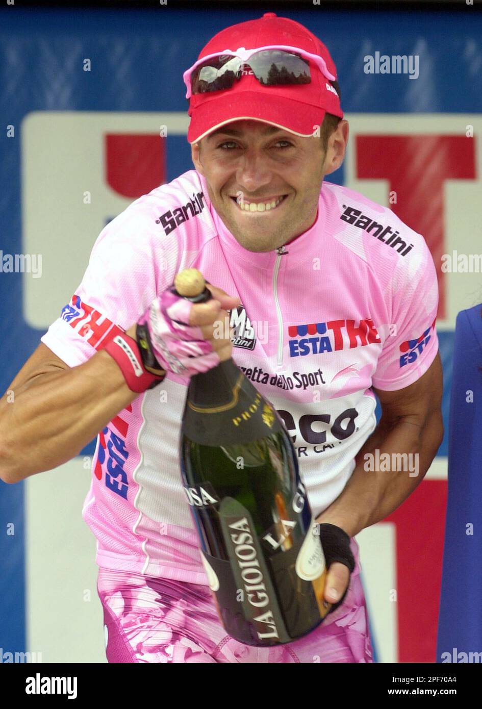 Italy's Gilberto Simoni is about to open a sparkling wine bottle as he ...