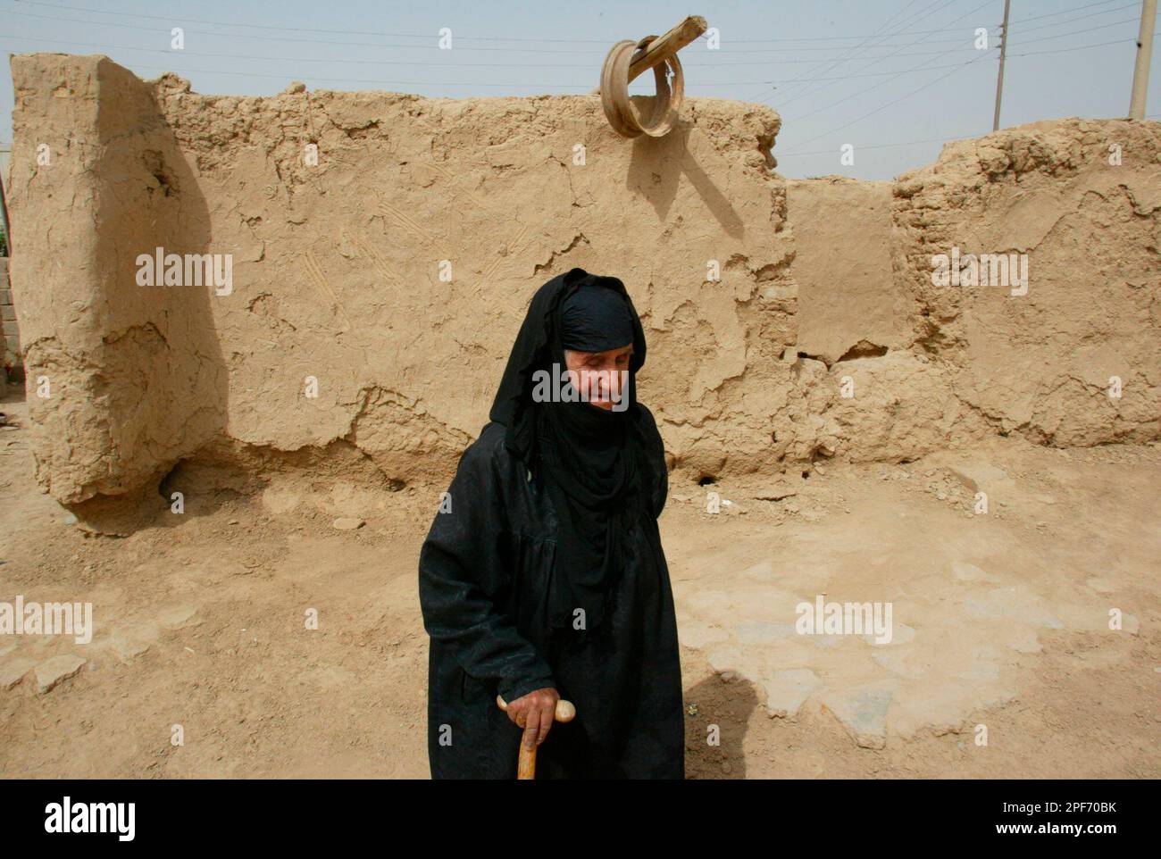 73-year-old Safiya Ahmed Hussain stands near her former home in Dujail ...