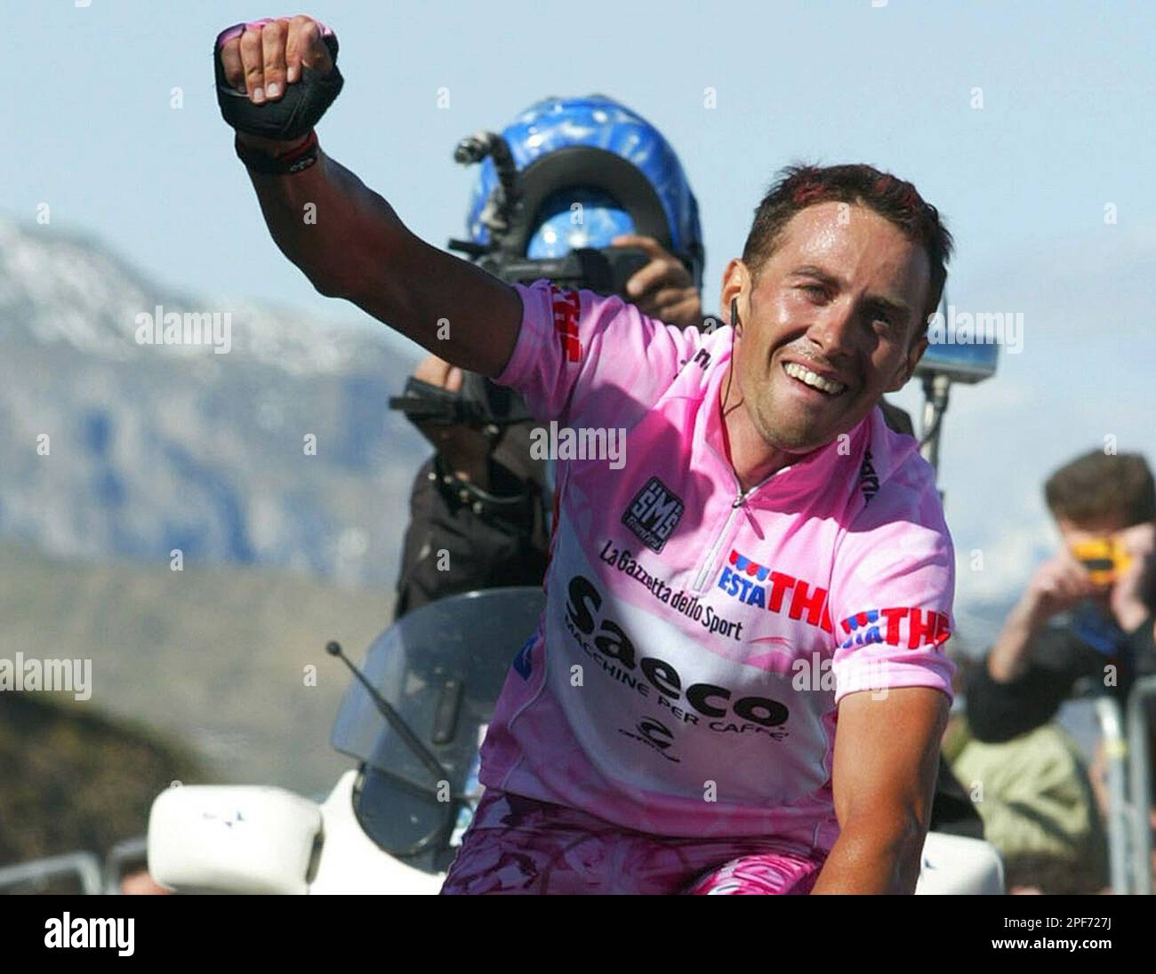 Italy's Gilberto Simoni celebrates as he crosses the finish line to win ...