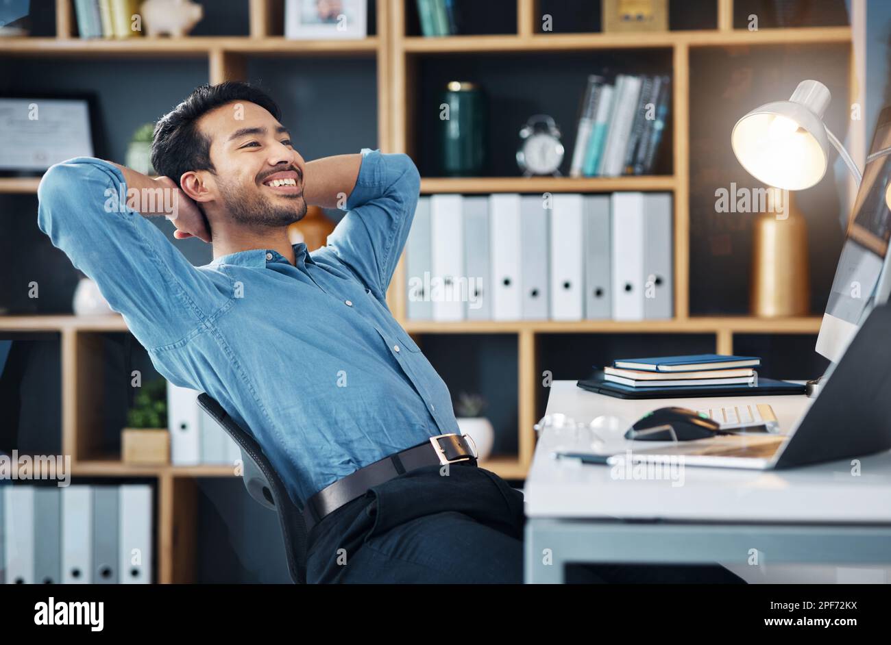 Happy business man stretching to relax from easy project, complete ...