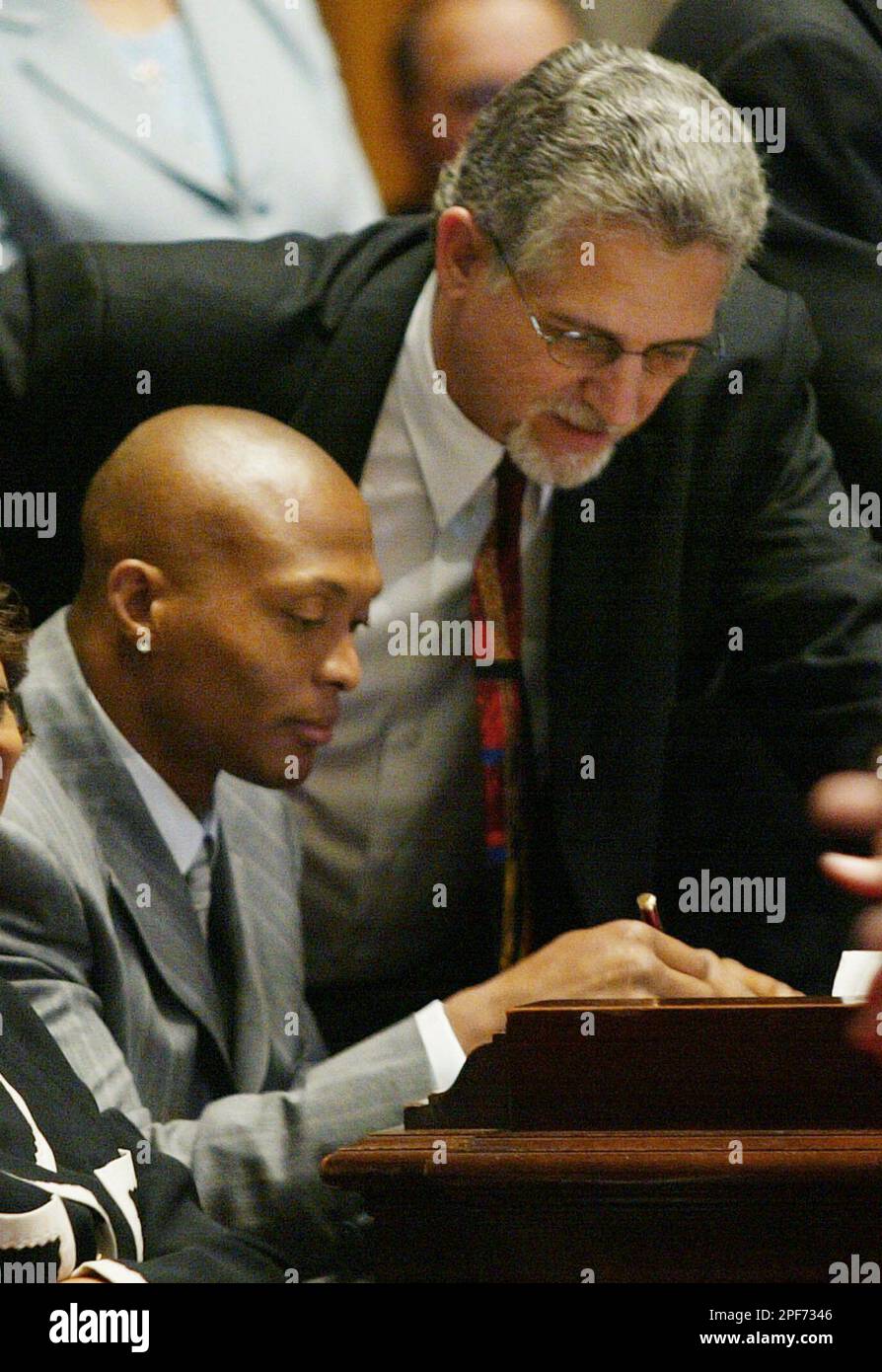 Tennessee Titans running back Eddie George signs an autograph for state ...