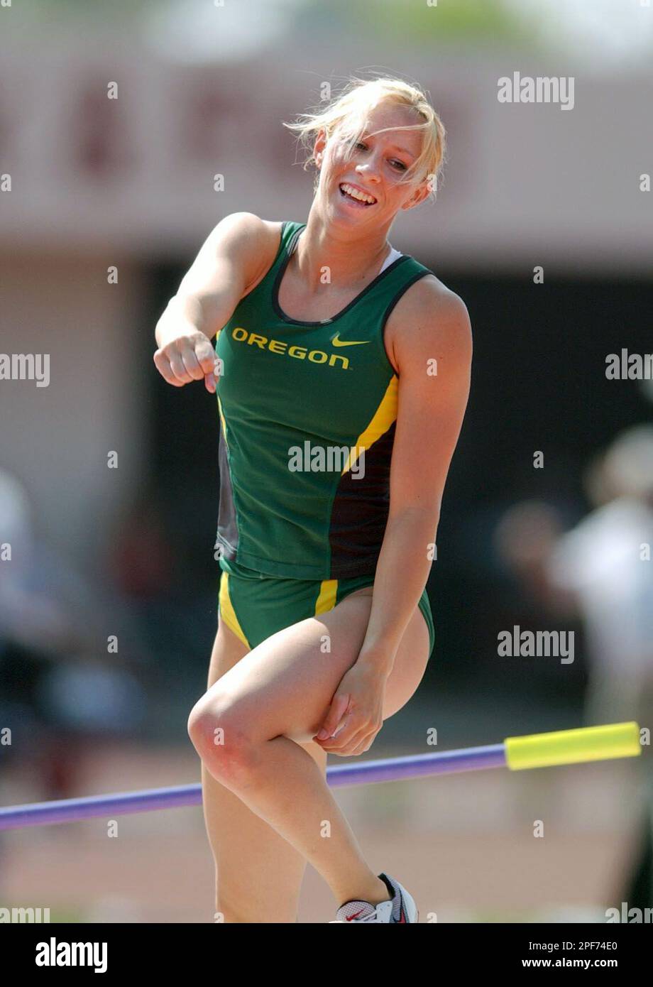 Becky Holliday of Oregon celebrates a meet record 14 feet, 6 inches in ...