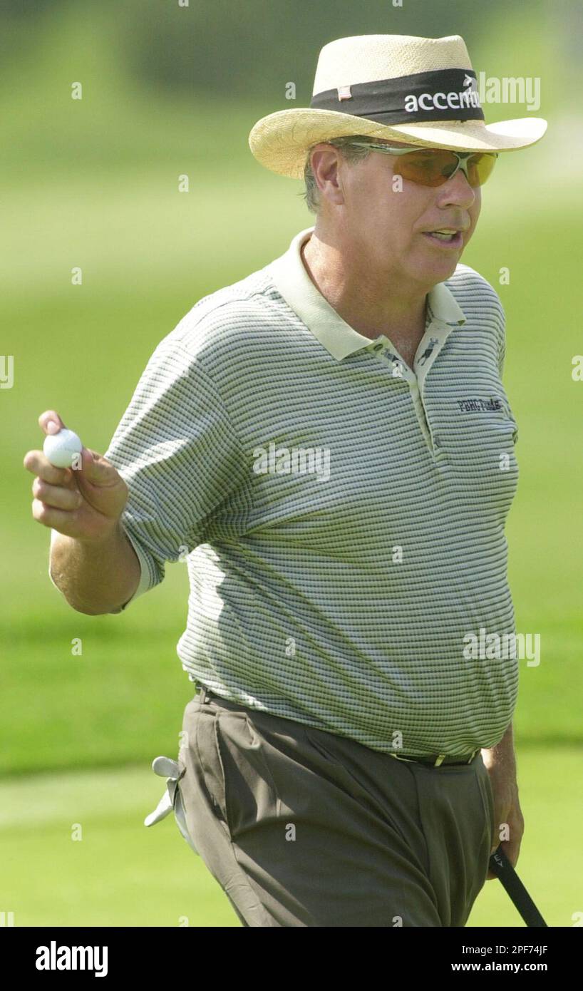 Jay Sigel holds up his ball after parring the 11th hole of the National ...