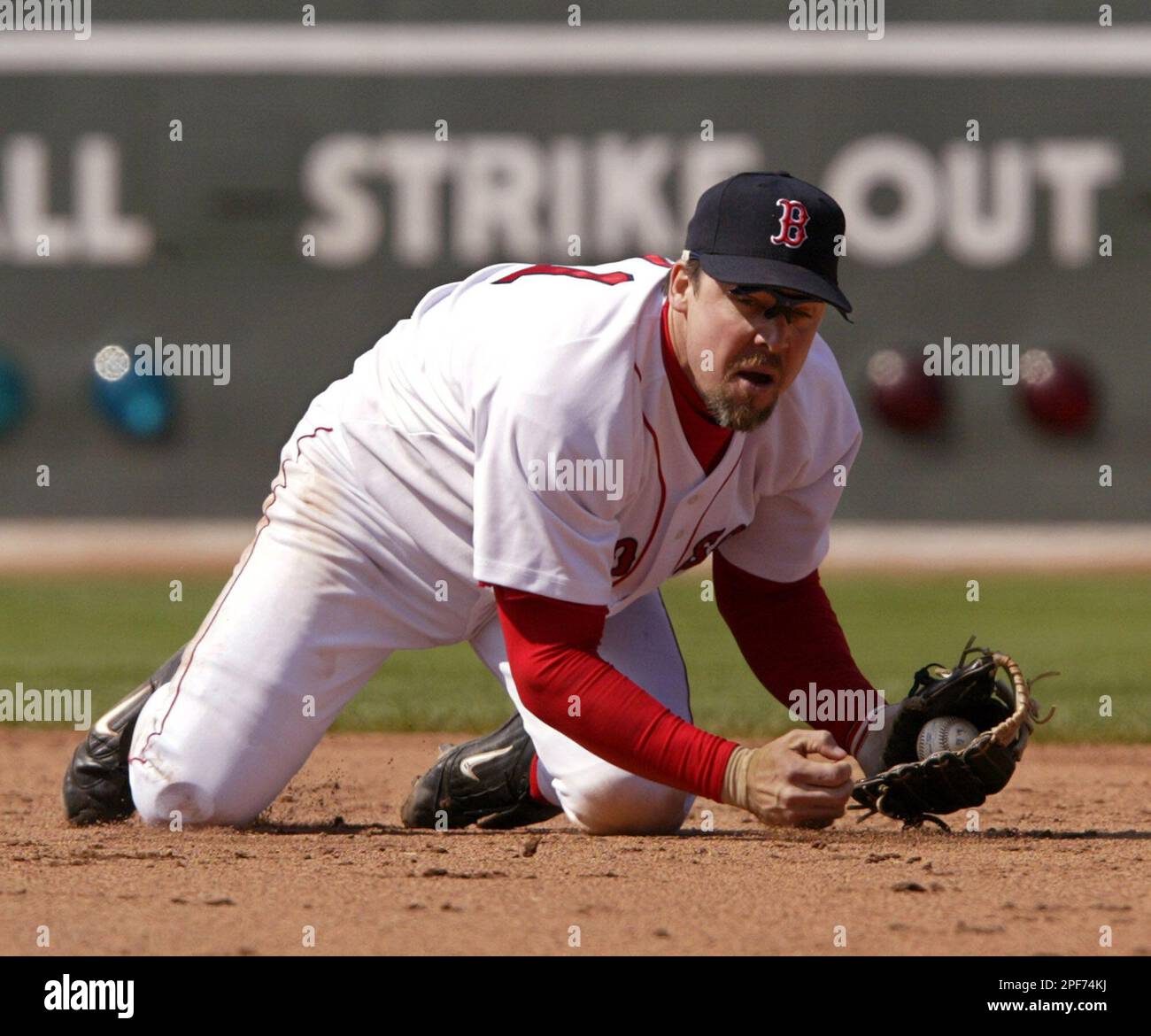 Boston Red Sox second baseman Bill Mueller tries to recover after ...