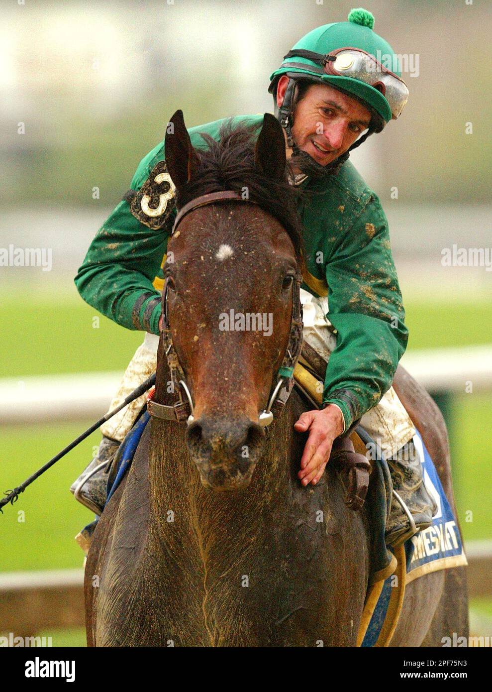 Robby Albarado give Mineshaft a pat as they return to the winner's ...