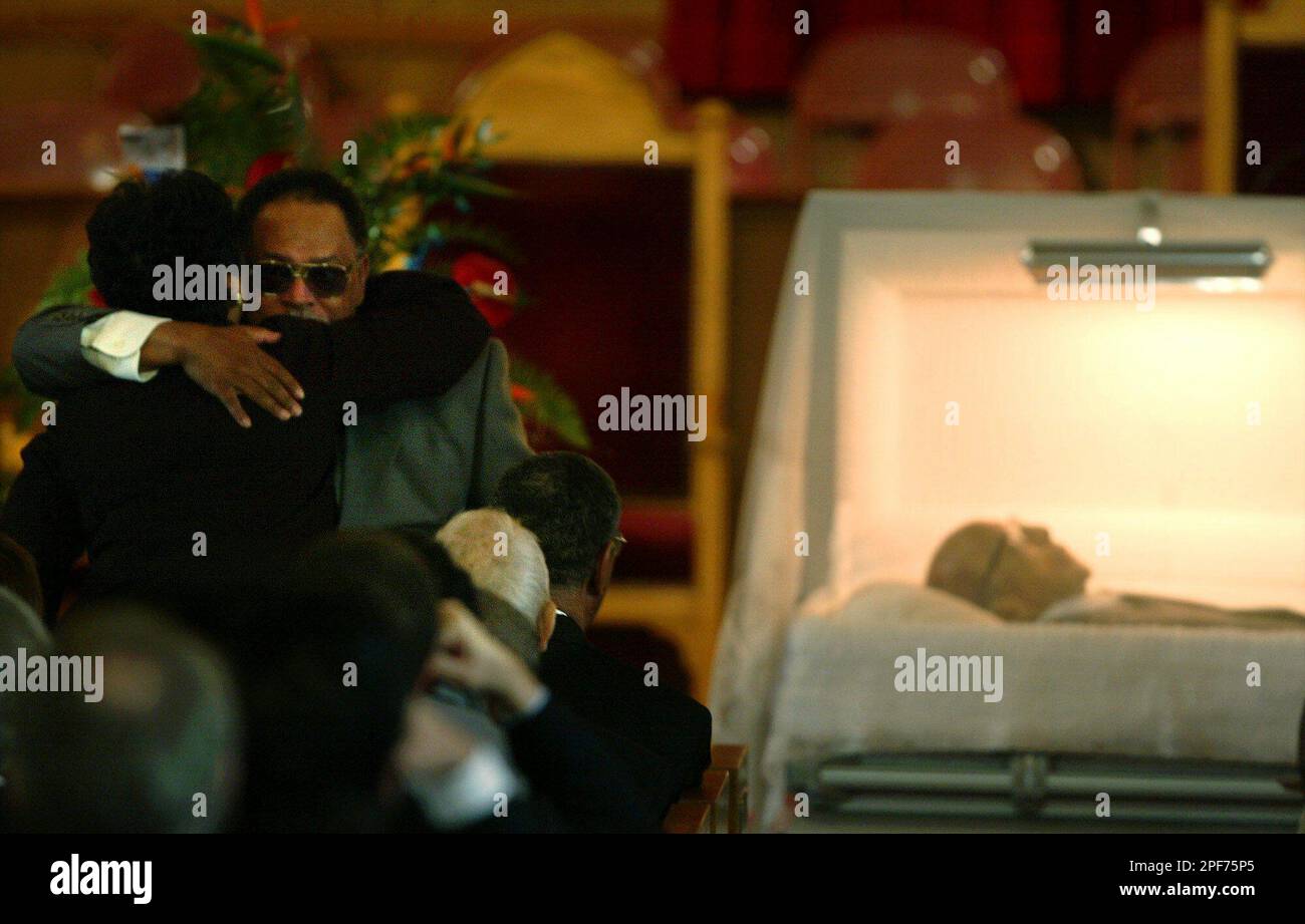 Connie Howard, second from left, hugs his cousin Vernice P. Lacy, at ...