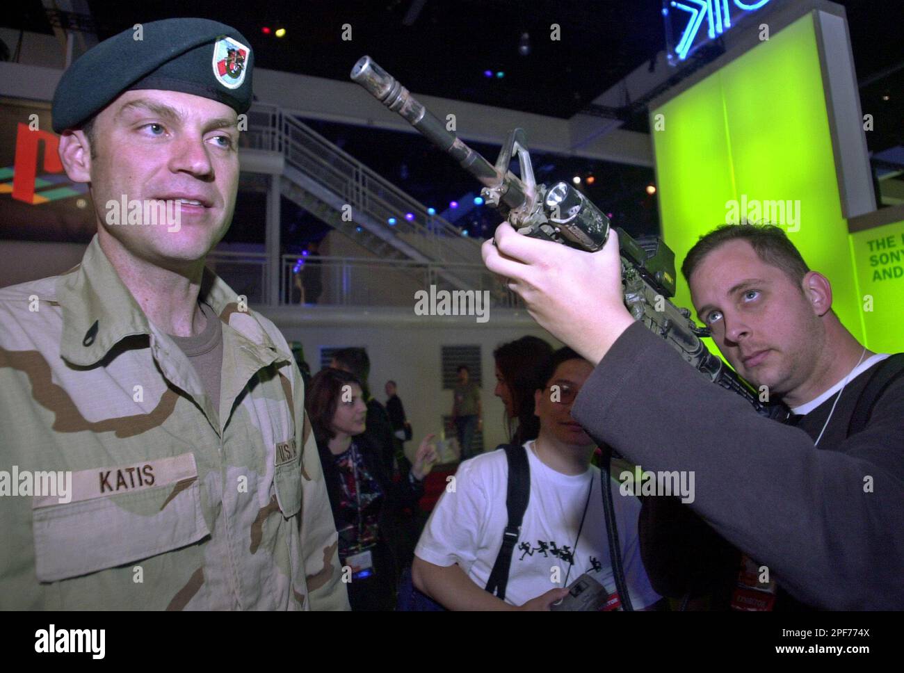 David King, a programmer with Novalogic, aims a rifle under the ...