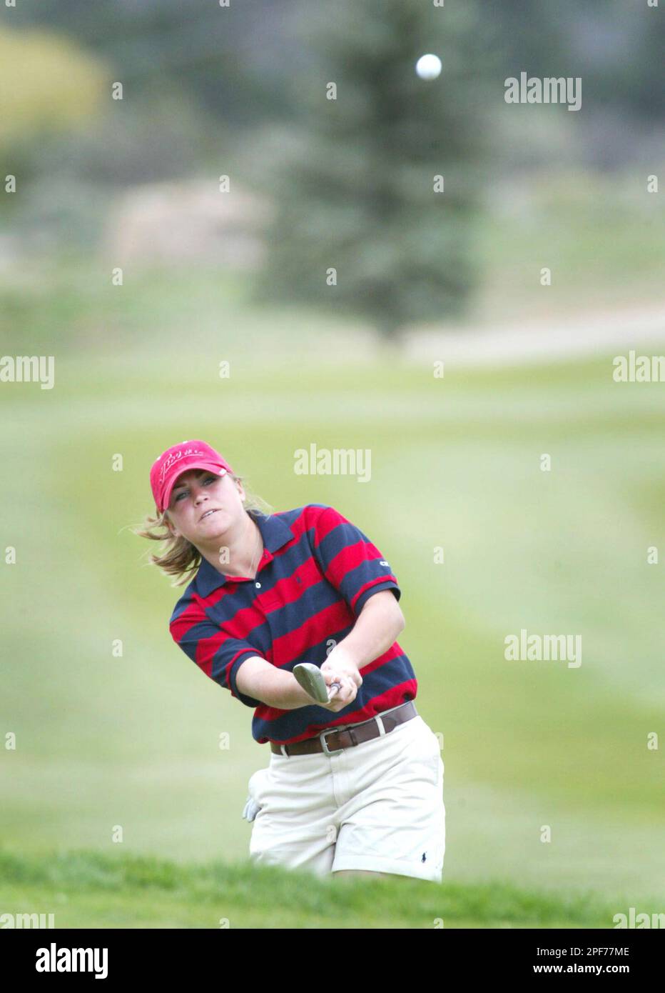 Ashley Prust of Cherry Creek High School chips onto the 13th green on ...