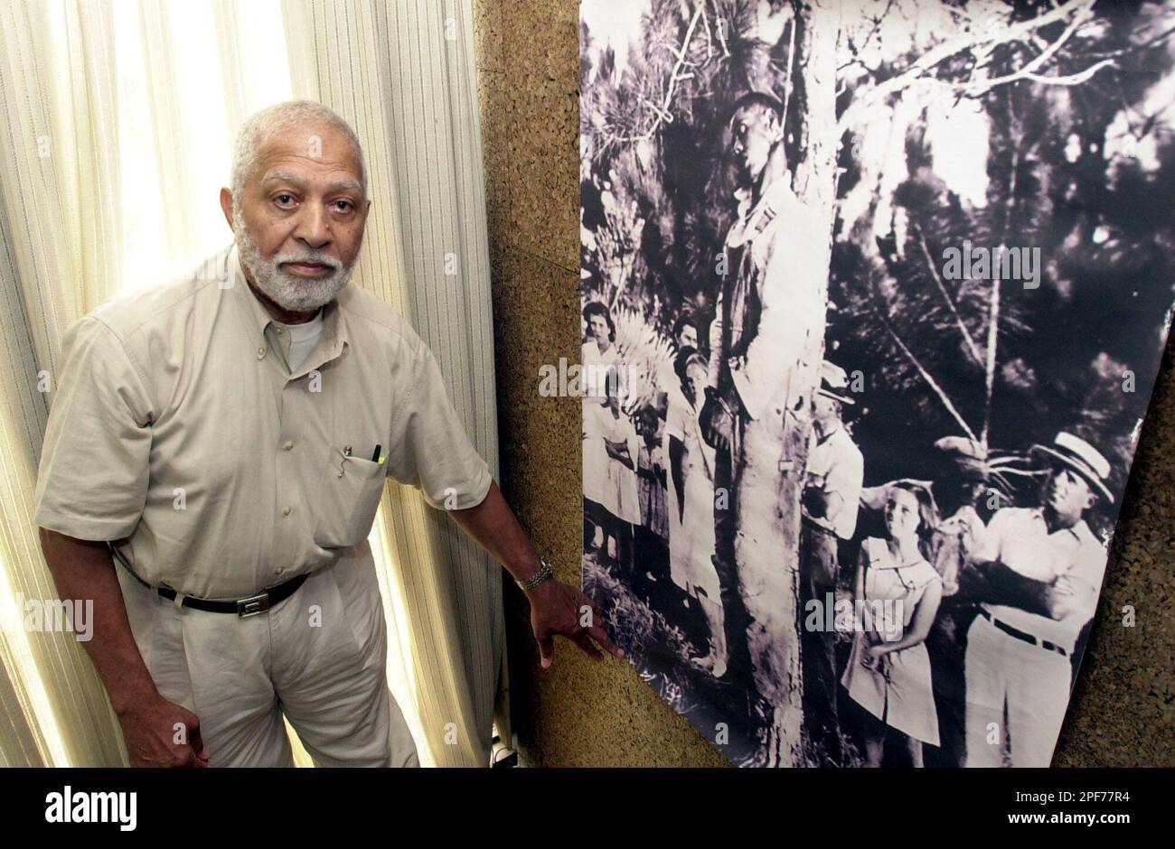 Tom Broadwater stands on May 1, 2003, in Atlanta beside an oversize ...
