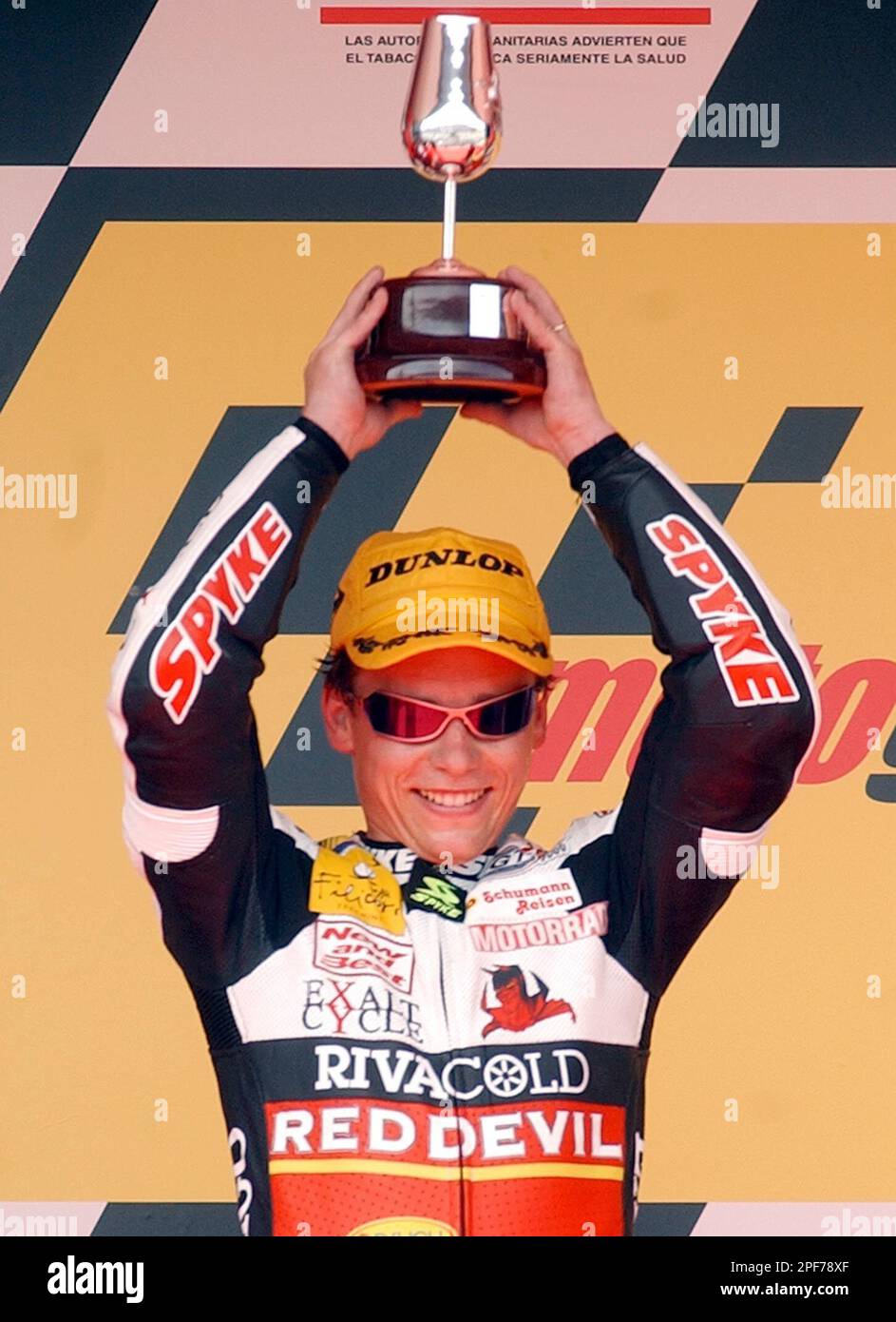 Steve Jenker of Germany lifts the trophy after finishing 2nd in the ...