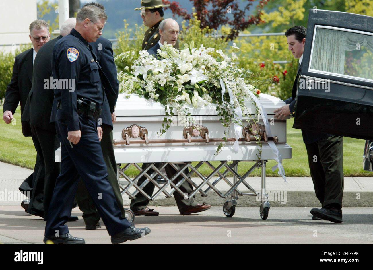 The casket of Crystal Brame is loaded into a hearse following her ...