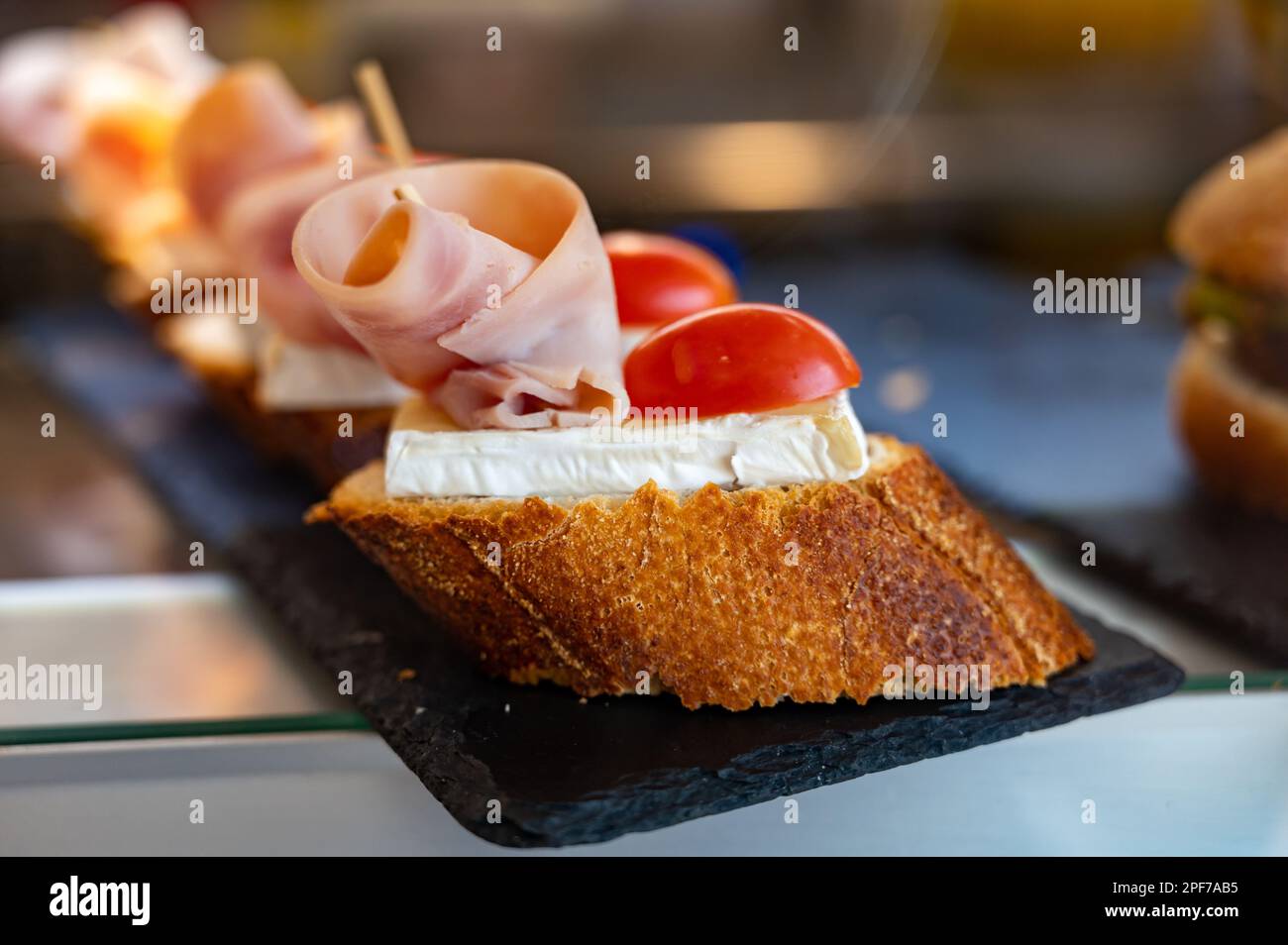 Typical mini burger snack of Basque Country, pinchos or pinxtos, small ...