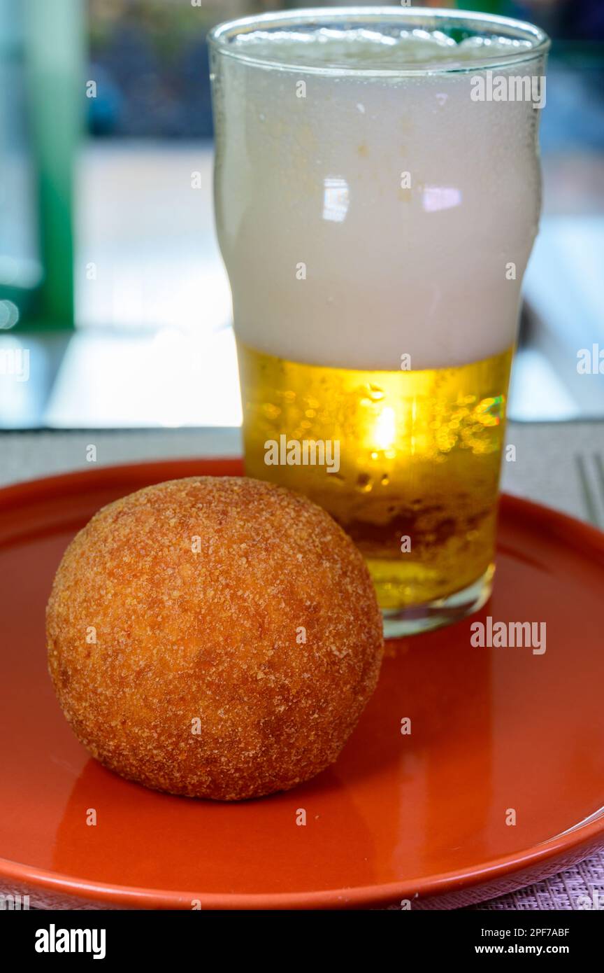 Traditional street food in Scotland, glass of fresh lager beer and ...