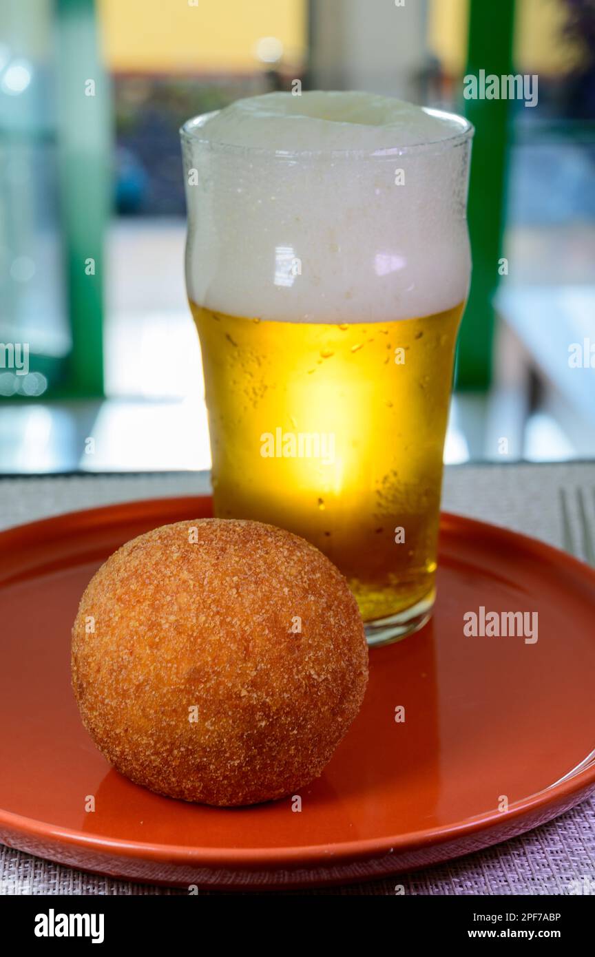 Traditional street food in Scotland, glass of fresh lager beer and ...
