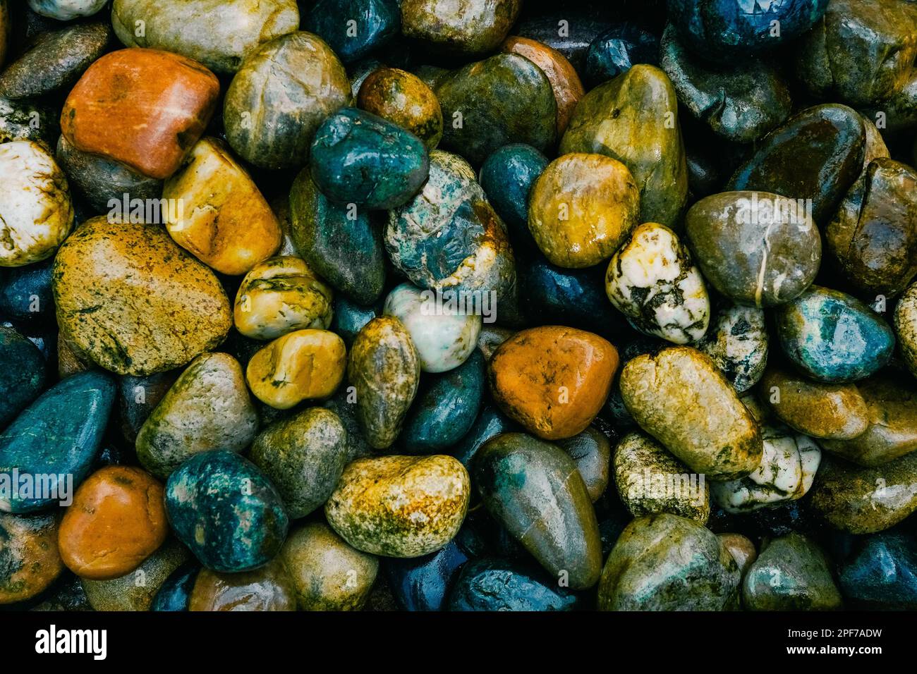 Colourful wet stones on beach hi-res stock photography and images - Alamy