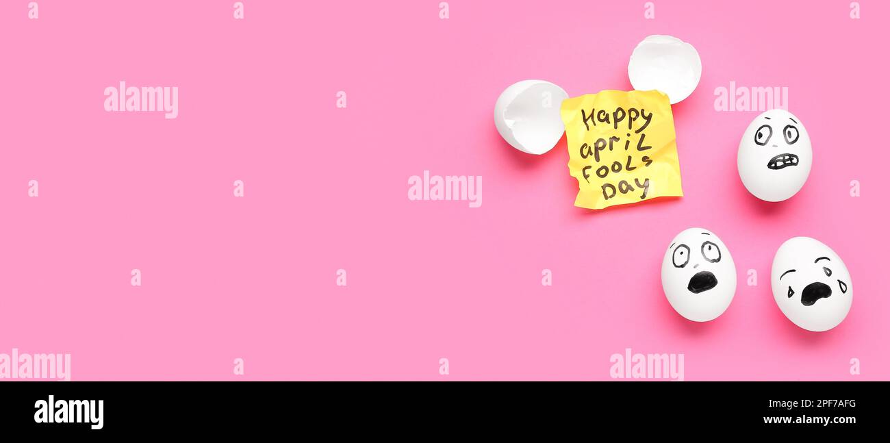 Paper with text HAPPY APRIL FOOLS DAY and funny eggs on pink background ...
