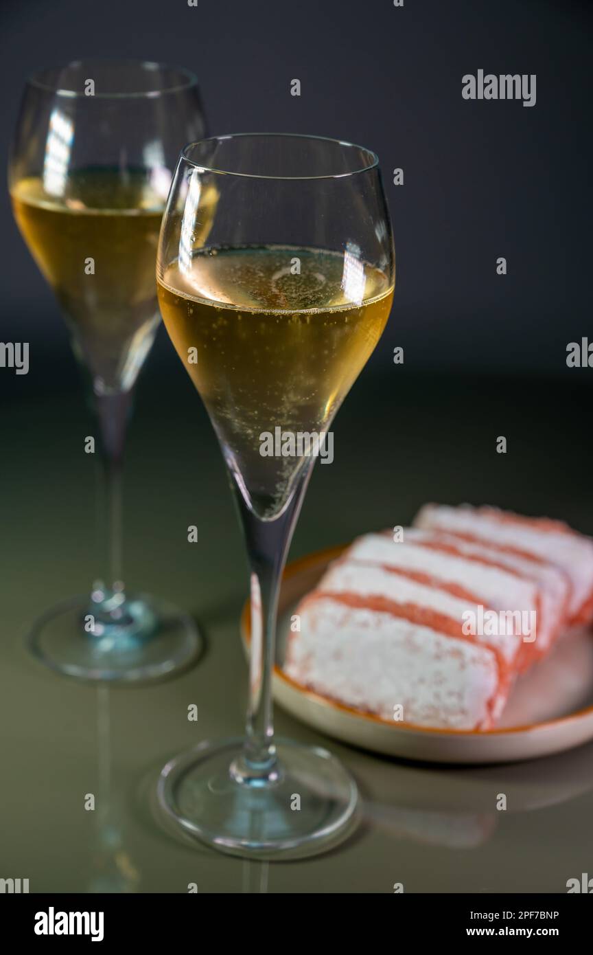 Glasses of sparkling white wine champagne or cava with bubbles and ...