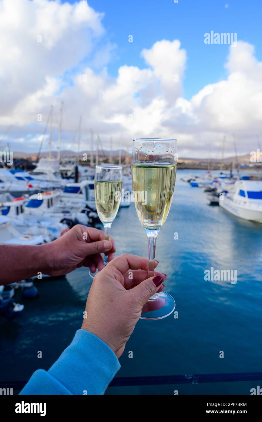Everyday party, hands with glasses of cava or champagne sparkling wine ...