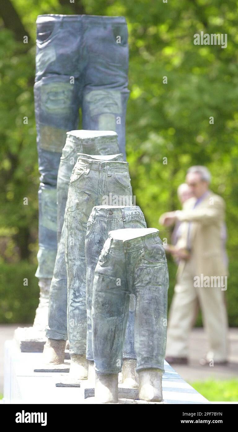 Sculptures of disembodied legs walking in blue jeans, made by Polish ...