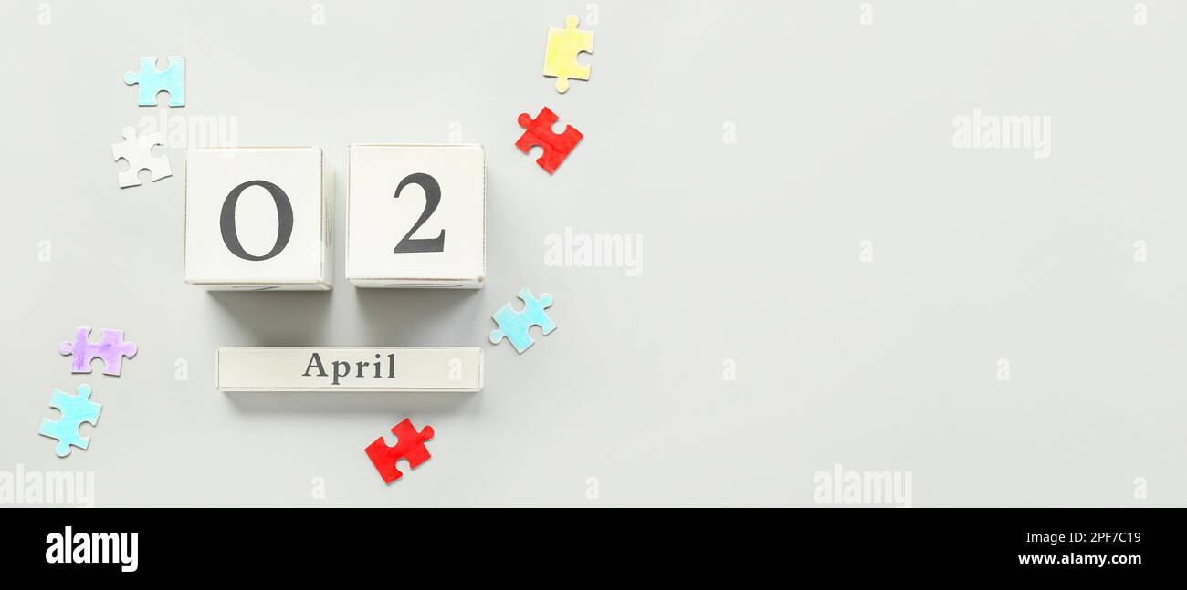 Calendar with date of World Autism Awareness Day and puzzle pieces on ...