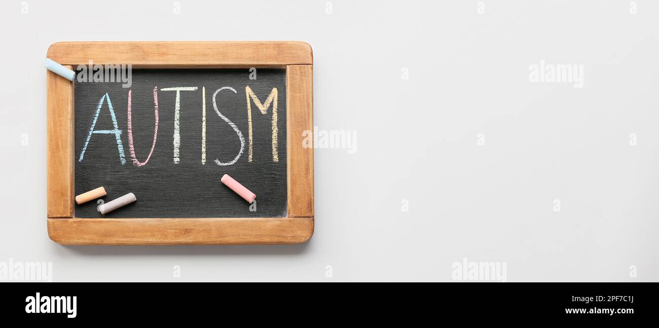 Chalkboard with word AUTISM on light background with space for text ...